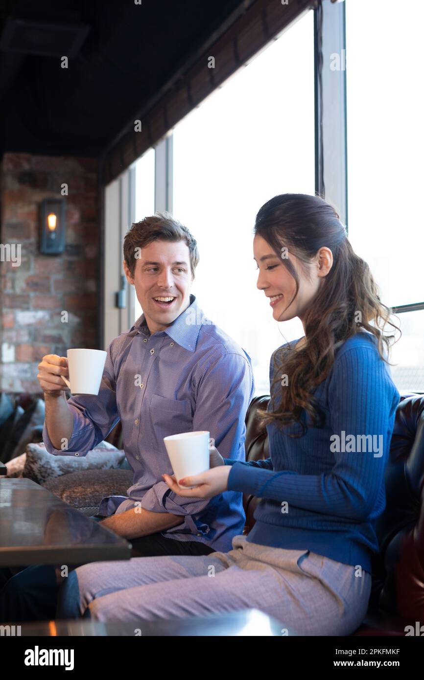 Couple chatting at the bar hi-res stock photography and images - Alamy
