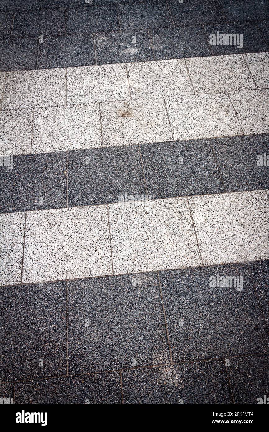 Textured walkway for blind people. Black tactile paving for the ...