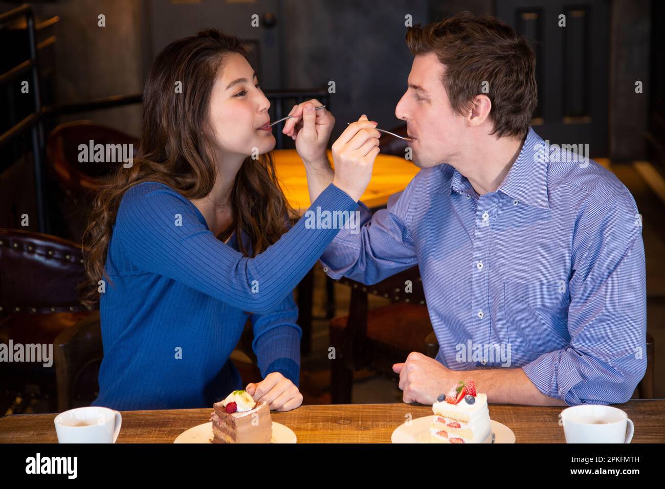 Young couple eating strawberry together hi-res stock photography and ...