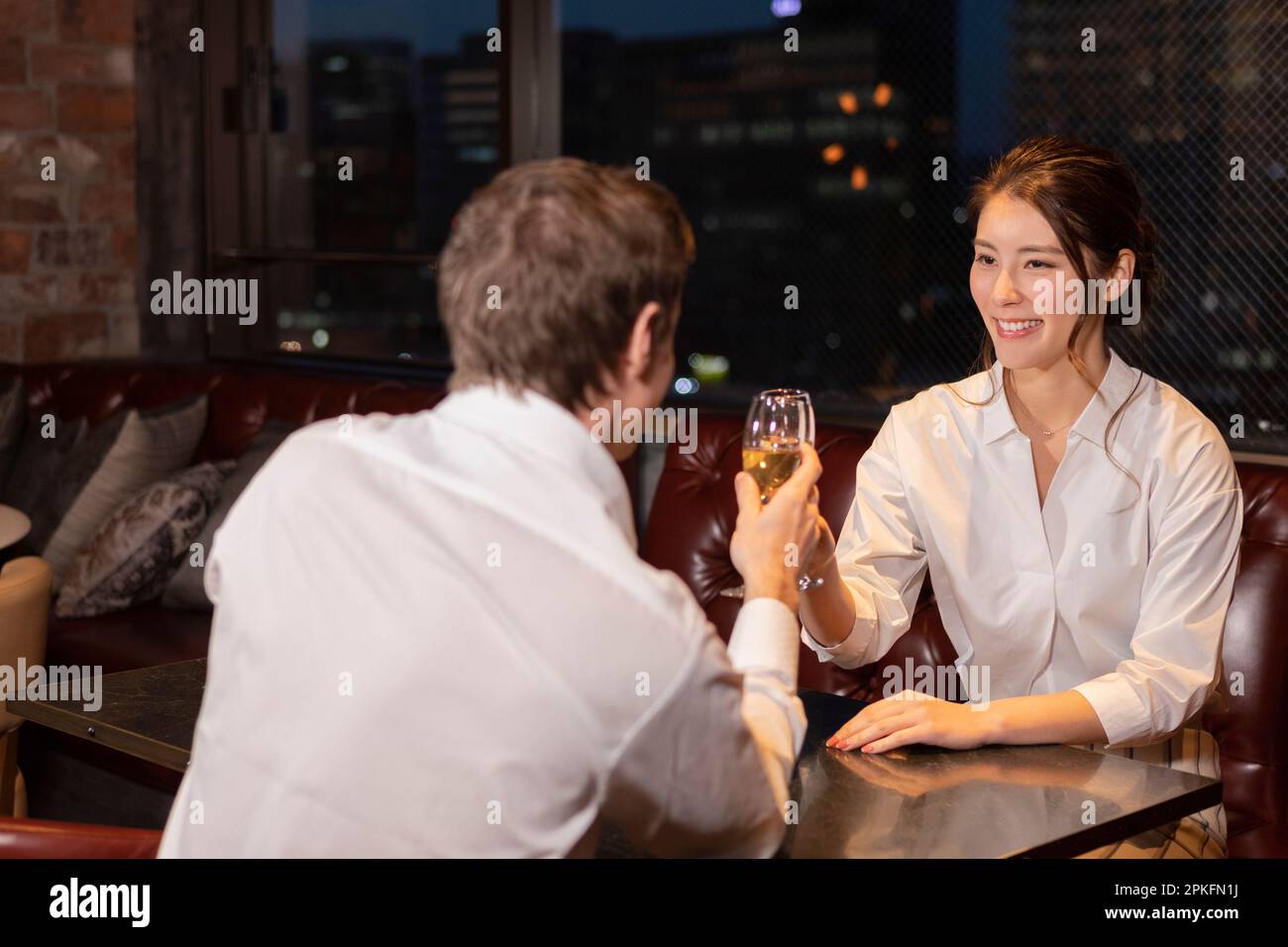 Couple making a toast Stock Photo - Alamy