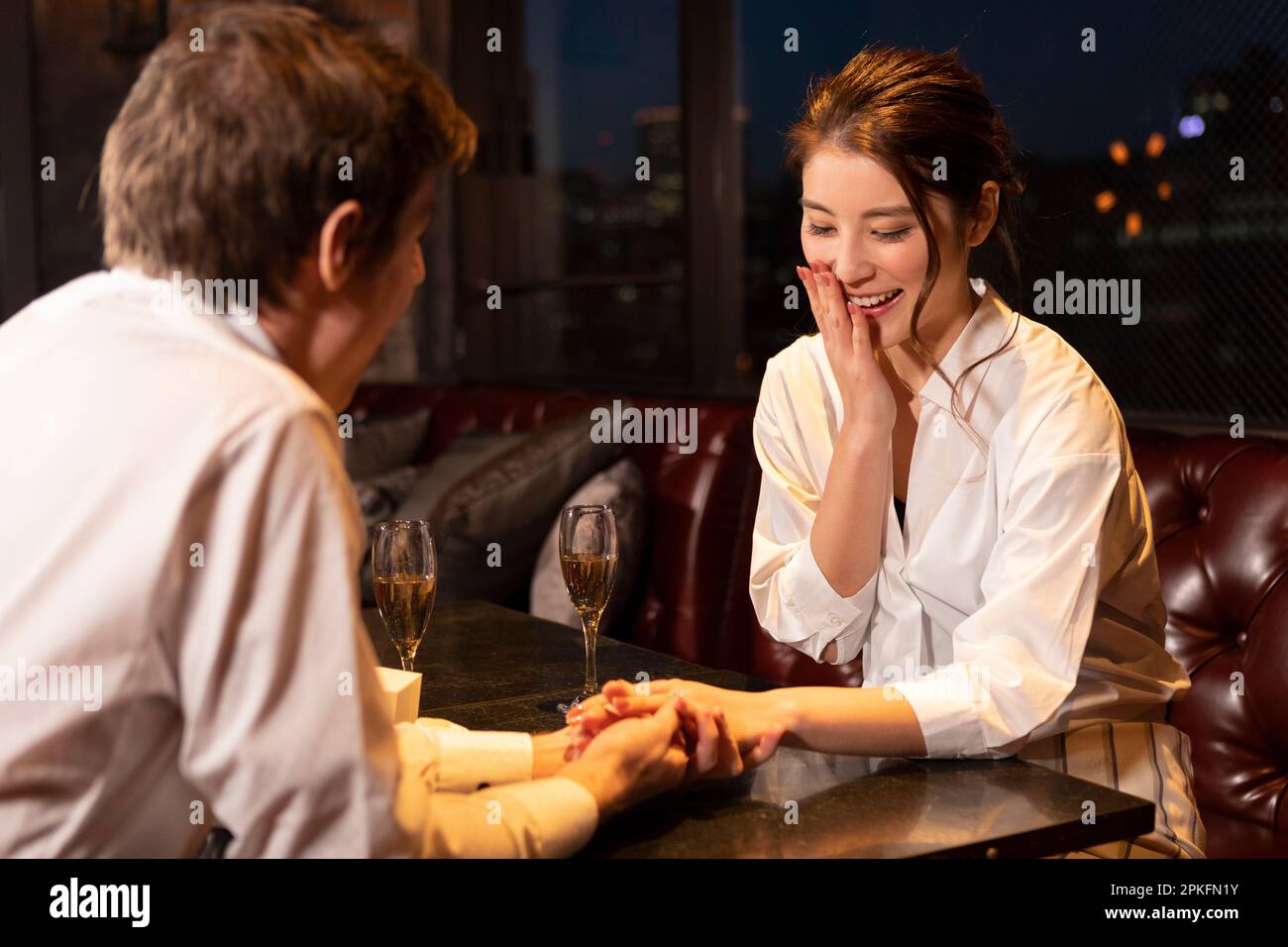 Happy man offering gift hi-res stock photography and images - Alamy