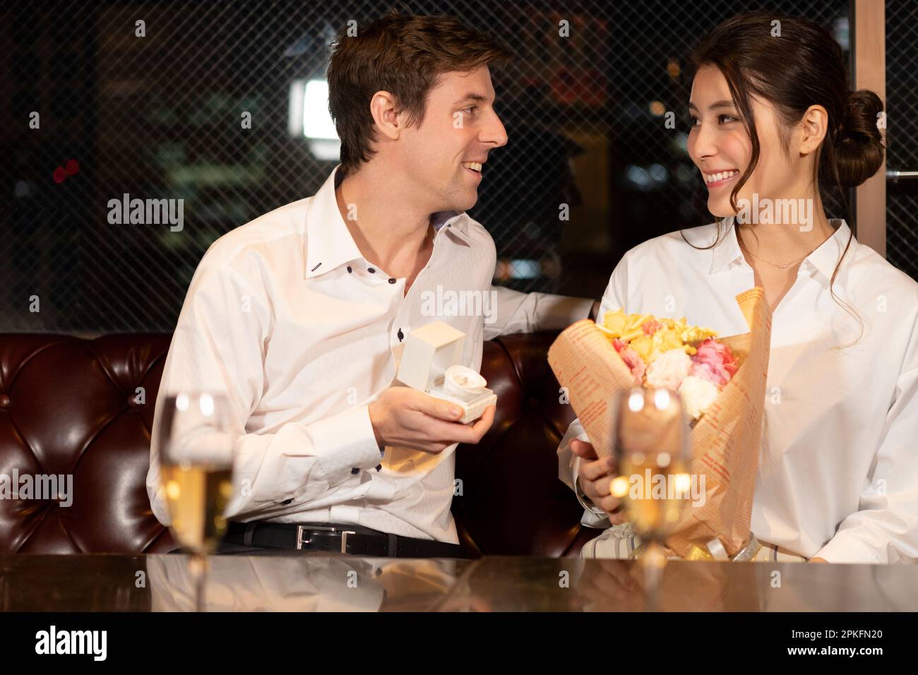 Woman passing flowers hi-res stock photography and images - Alamy