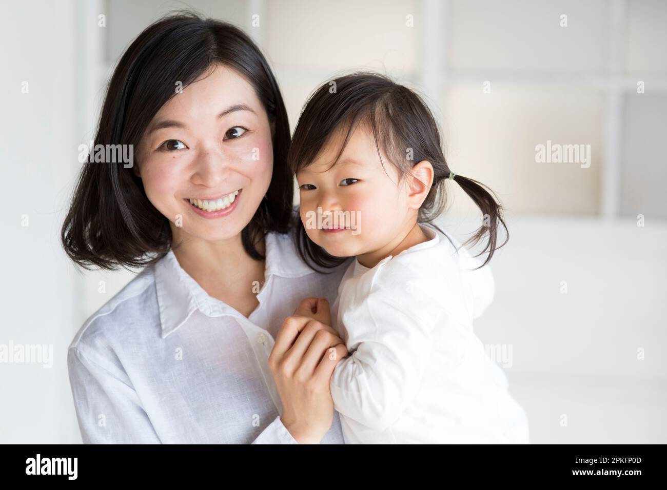 Mother holding child Stock Photo - Alamy