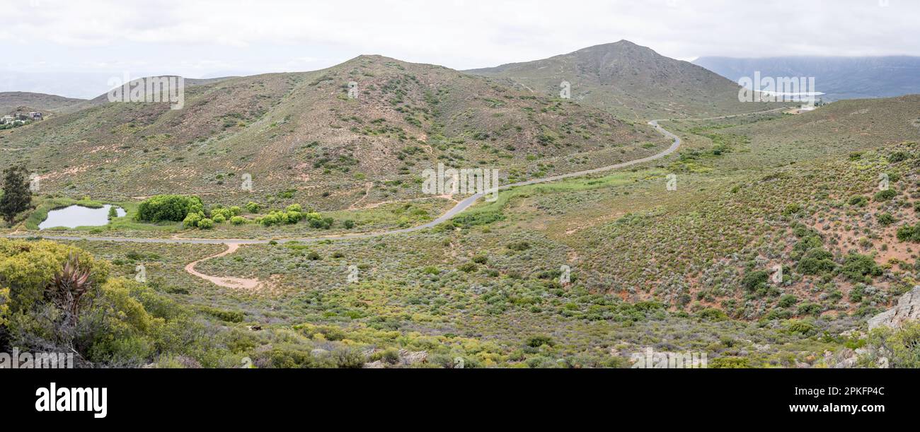 aerial landscape with road winding in hilly countryside covered with ...