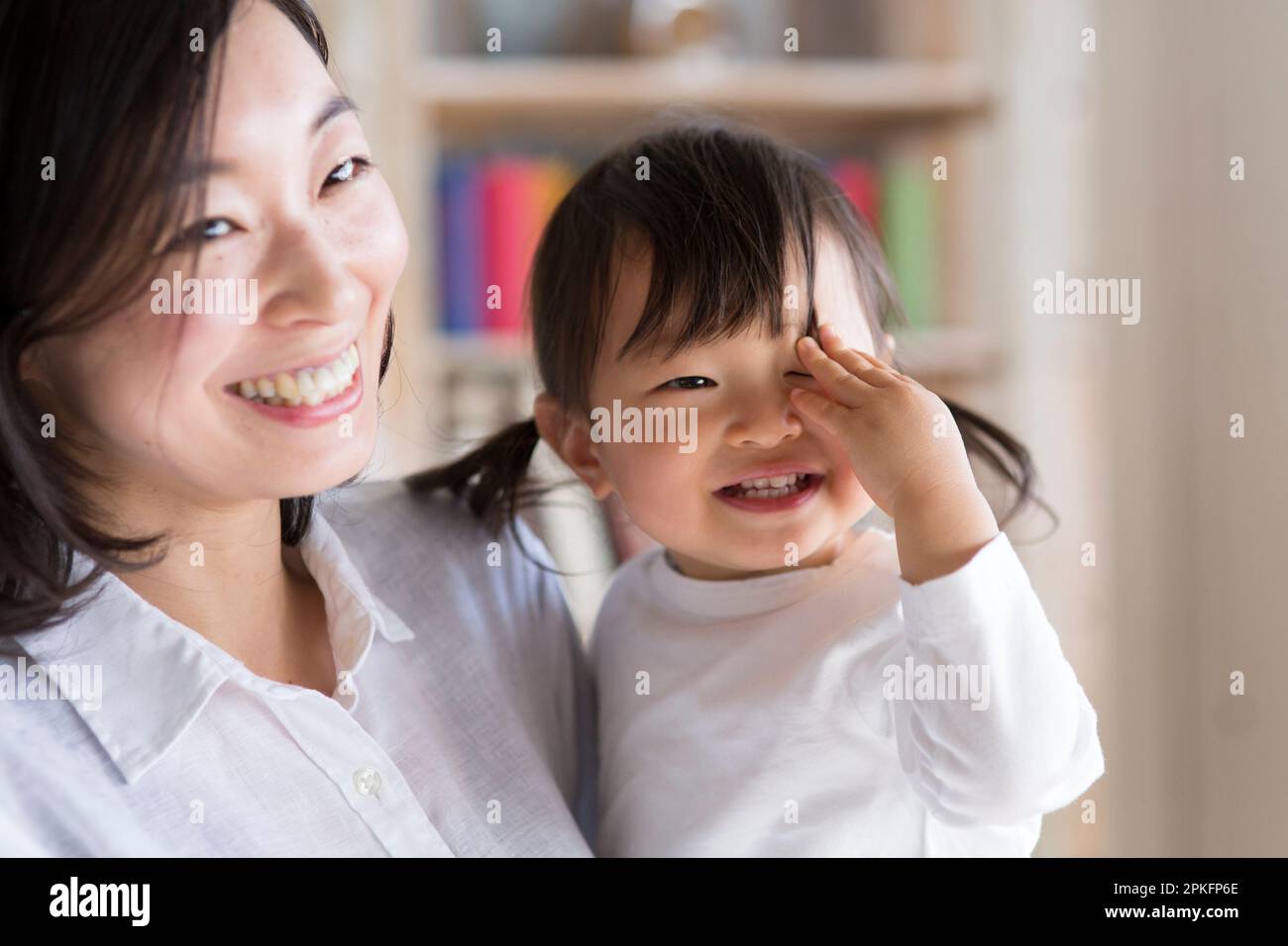 Child being held hi-res stock photography and images - Alamy