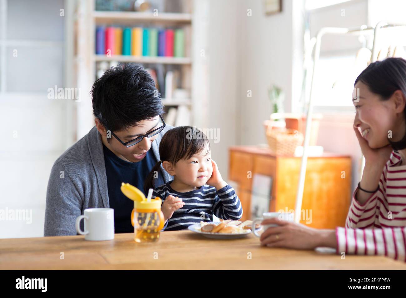 Parent and child relaxing in the living room Stock Photo - Alamy
