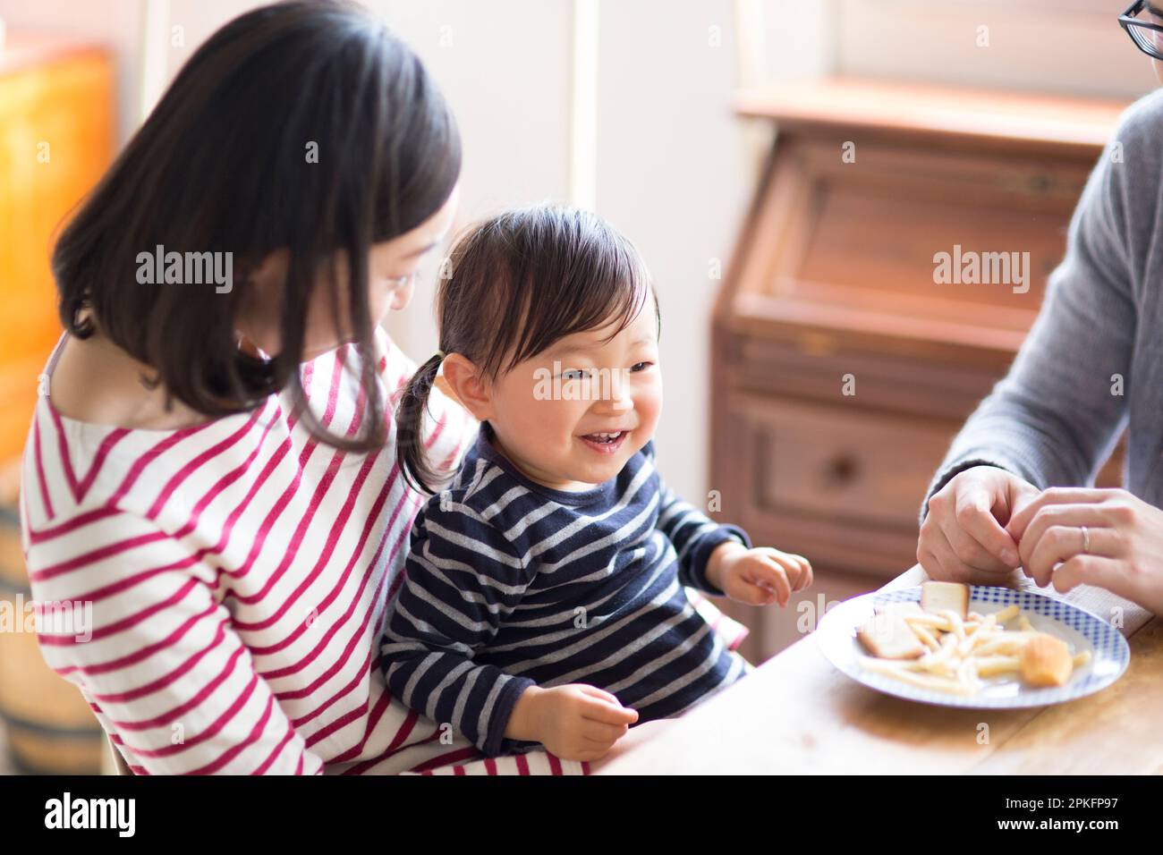 Family eating a snack Stock Photo - Alamy