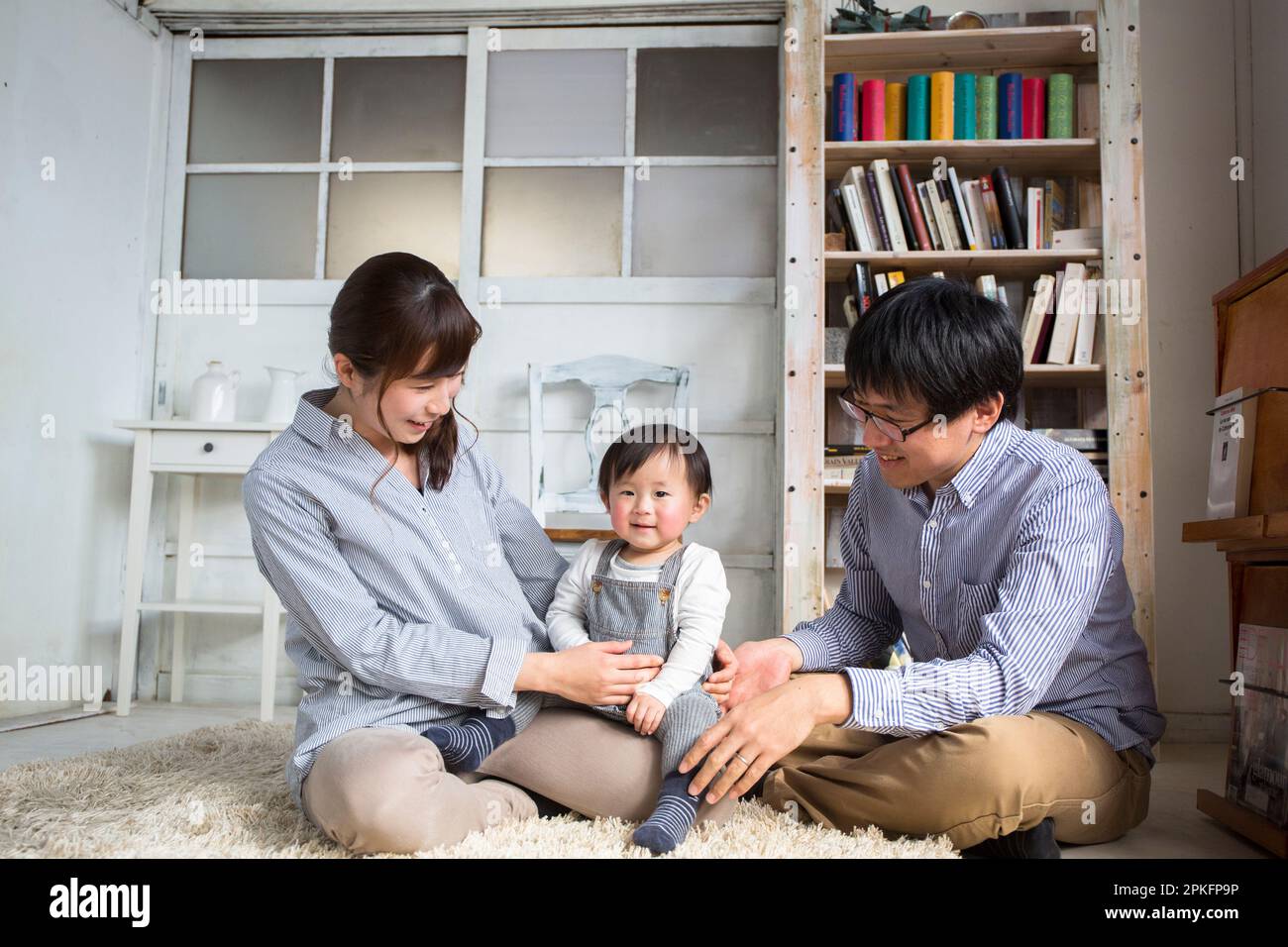 Parents Playing with Baby Stock Photo - Alamy