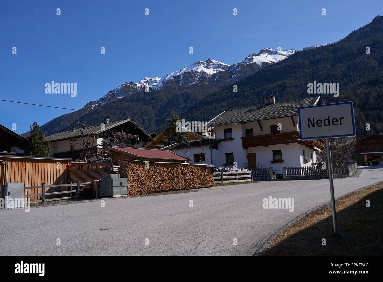 Neder, Austria - March 16, 2023 - a small town in an alpine valley ...