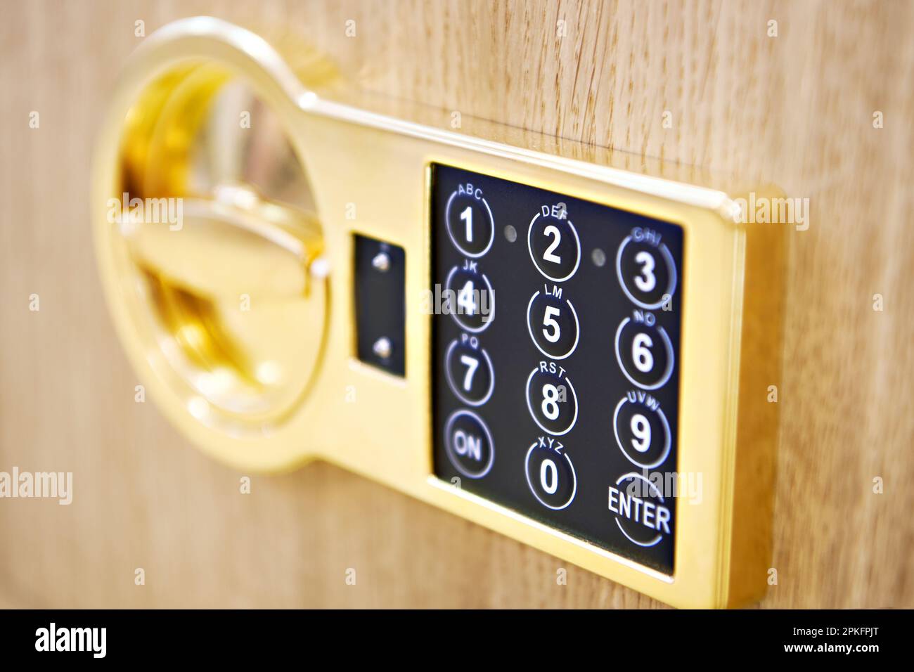 Digital combination safe lock golden Stock Photo - Alamy