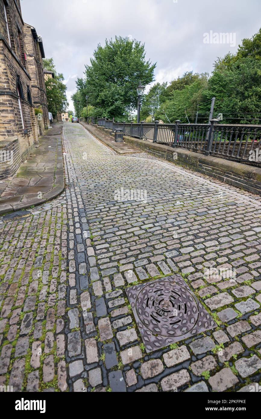 Victorian cobbled street alongside Saltaire Railway Station, Saltaire ...