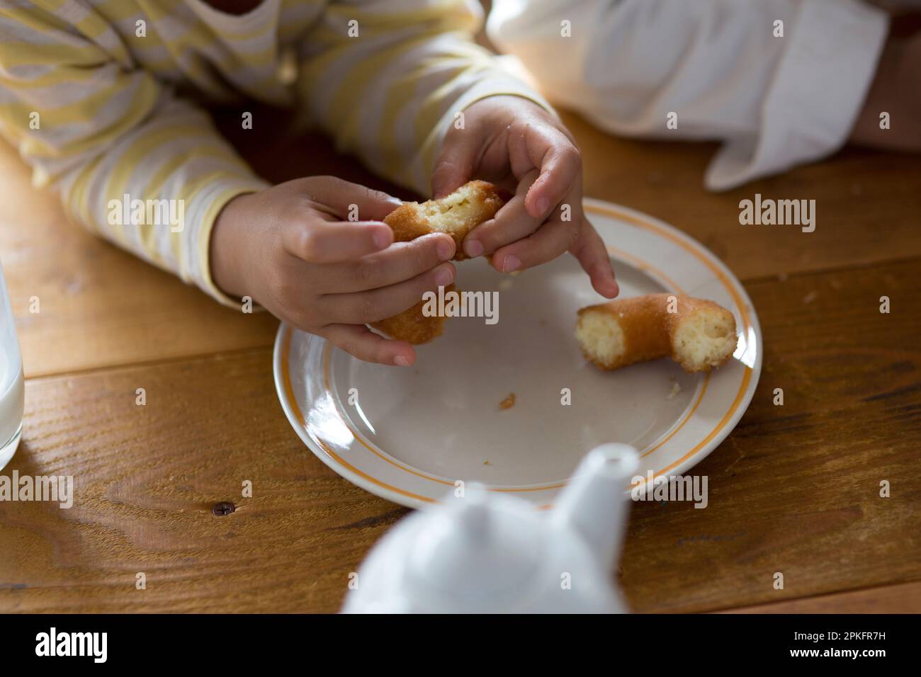 Toddler hands eating hi-res stock photography and images - Alamy