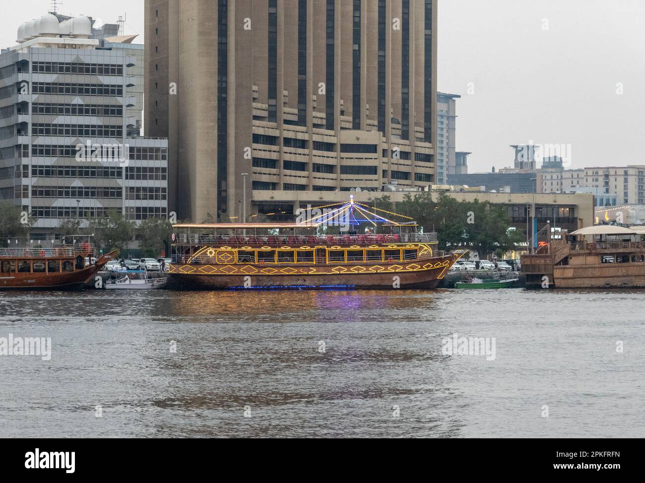 View along the Creek towards Deira with large dhow tour boats docked by ...