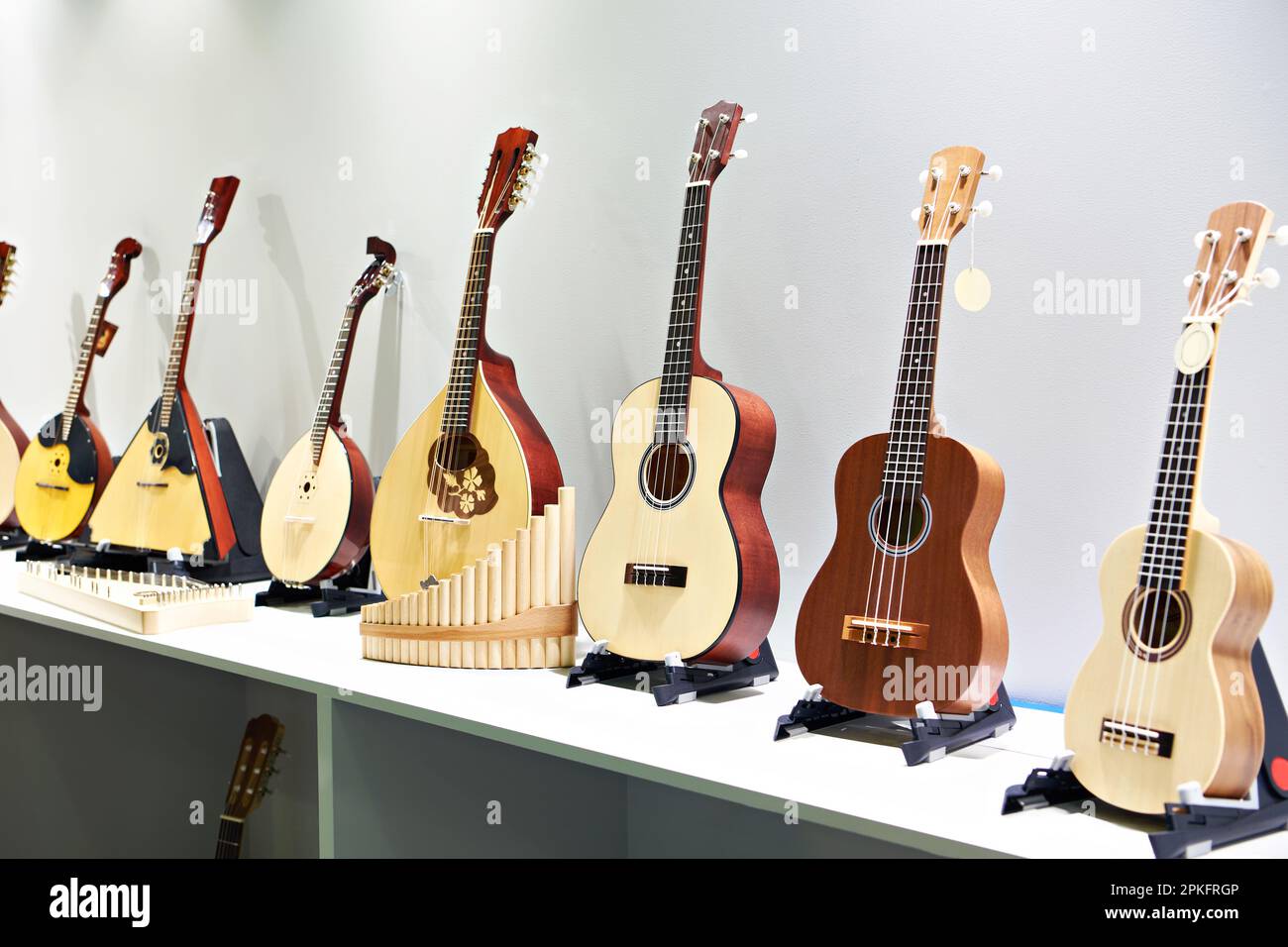 Guitars and stringed musical instruments in a store Stock Photo - Alamy Guitars and stringed musical instruments in a store Stock Photo - Alamy