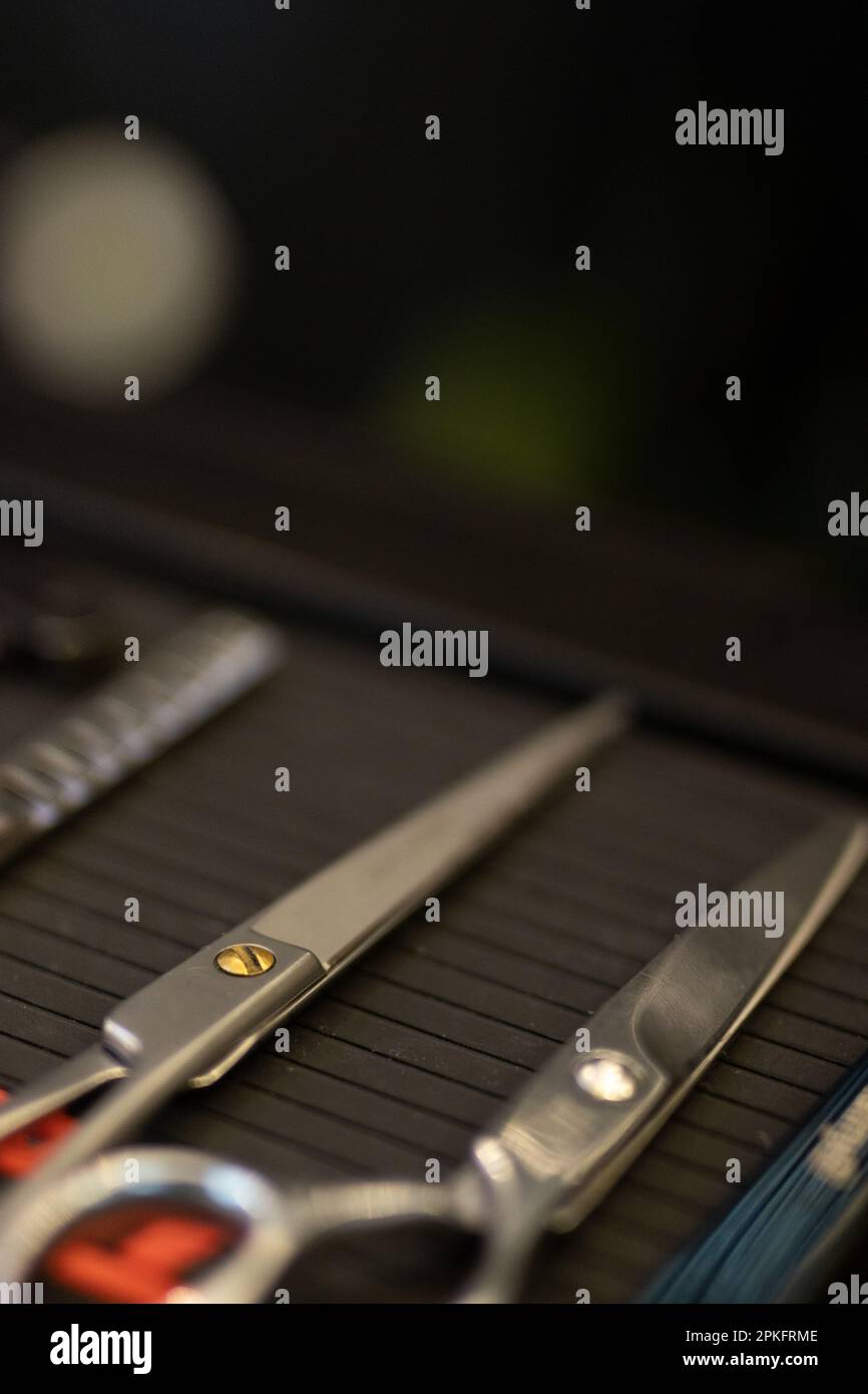 Barber work table. Snipping tools neatly arranged Stock Photo - Alamy