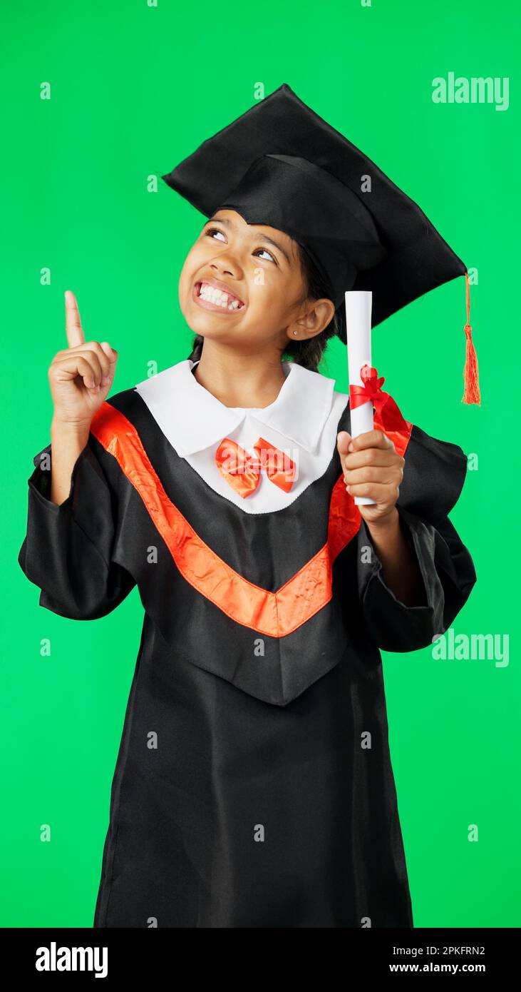 Graduation, education and child point on green screen for graduate ...