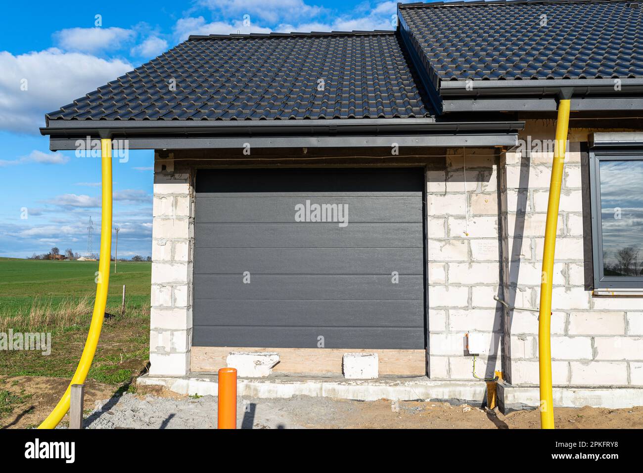 100mm diameter yellow PVC pipe connected to the end of the gutter on ...