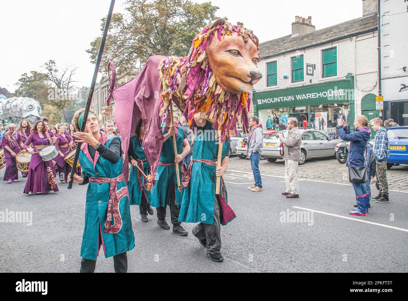 A lion's head and face take part in the street parade held at the ...