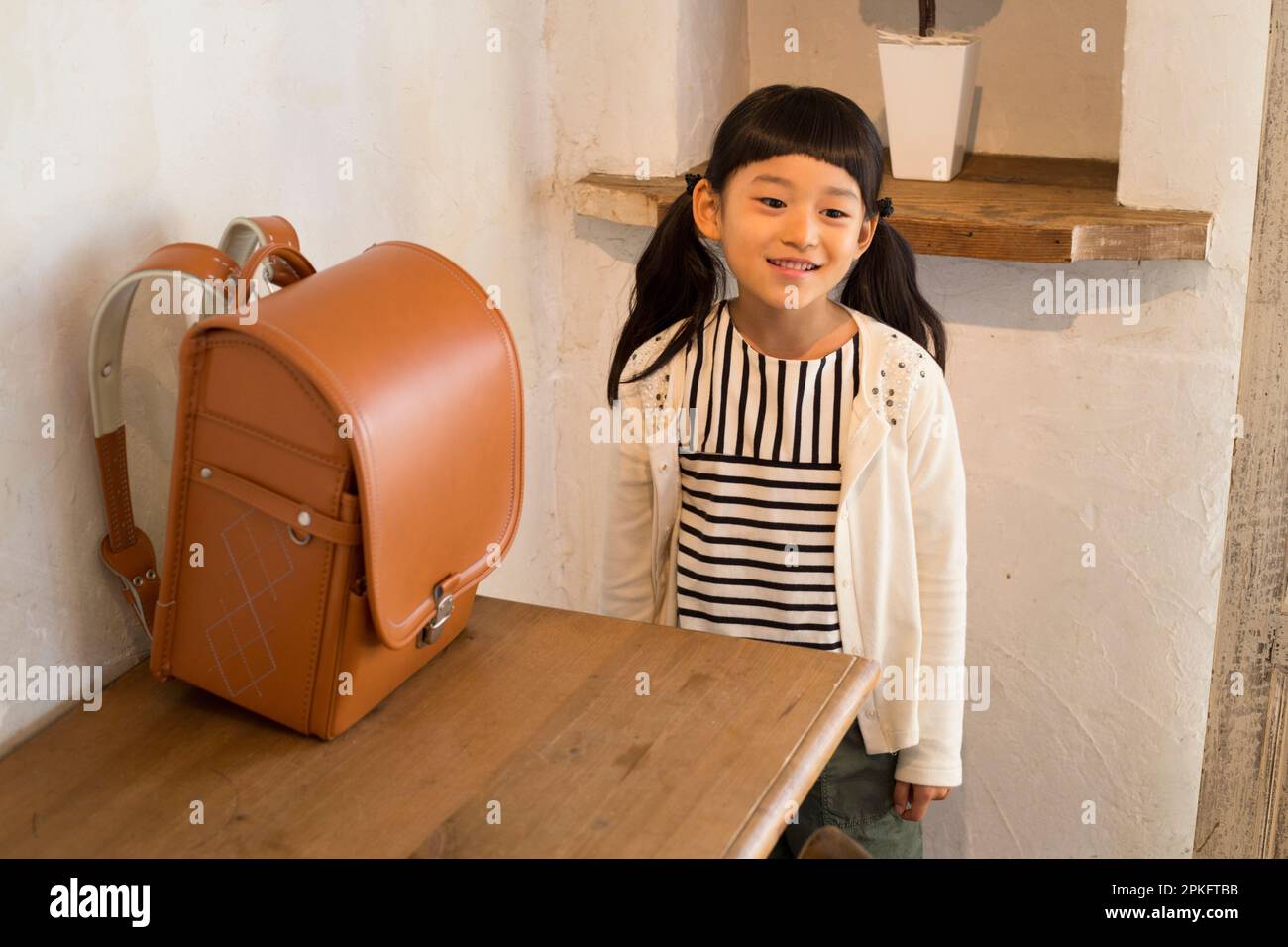 Elementary School Girl with School Bag Stock Photo - Alamy