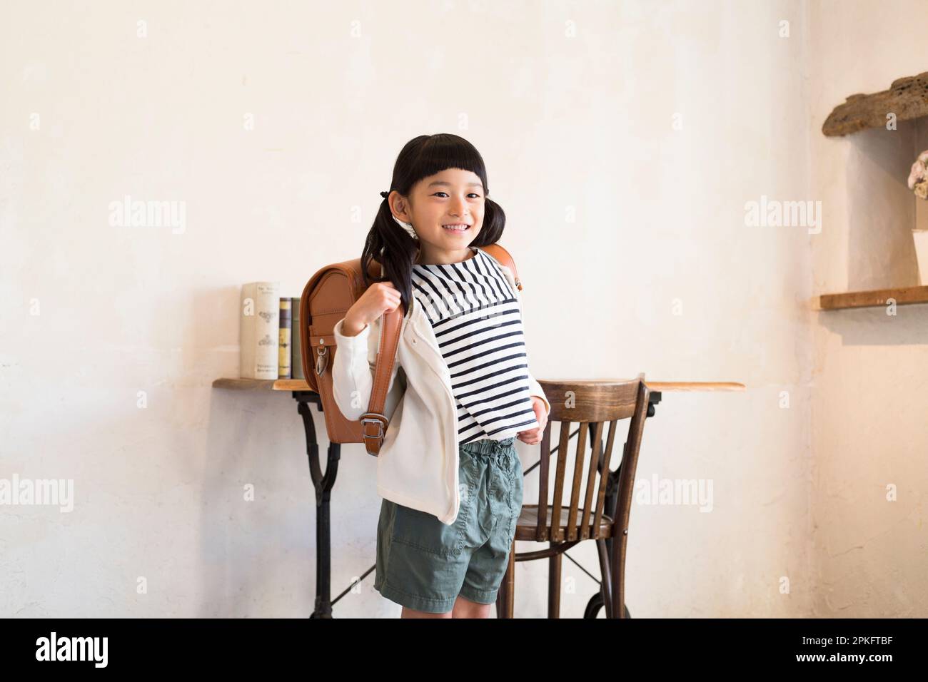 Elementary School Girl Carrying a School Backpack Stock Photo - Alamy