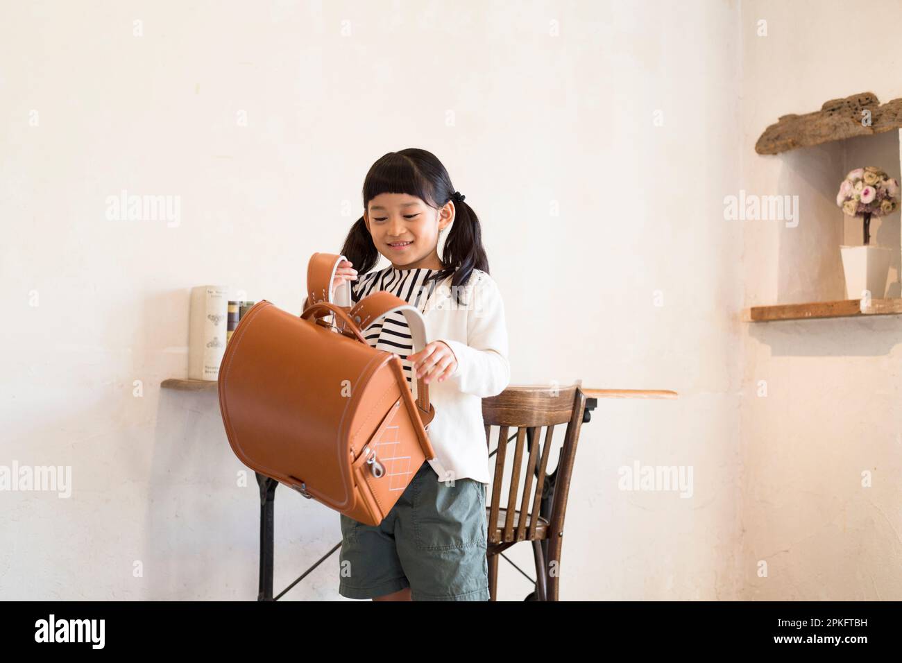 An Elementary School Girl Carrying a School Bag Stock Photo - Alamy