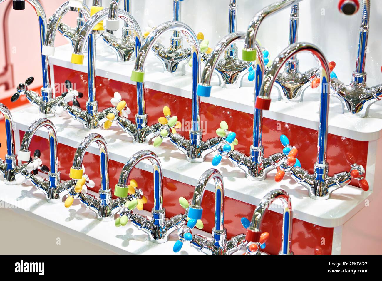 Modern kitchen water faucets in the store Stock Photo - Alamy