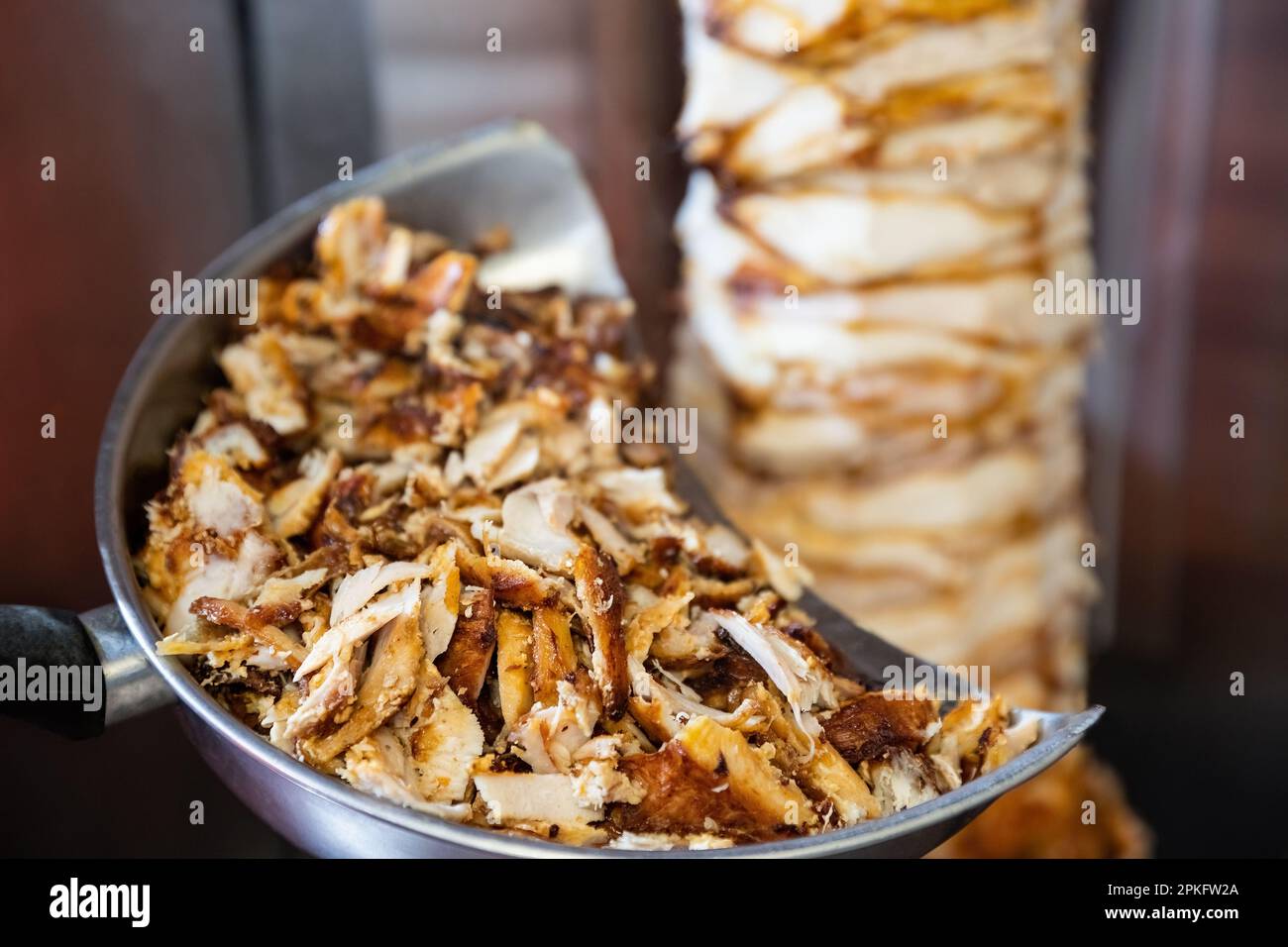 Juicy Greek traditional gyros grilled on fire and chopped for wrap ...