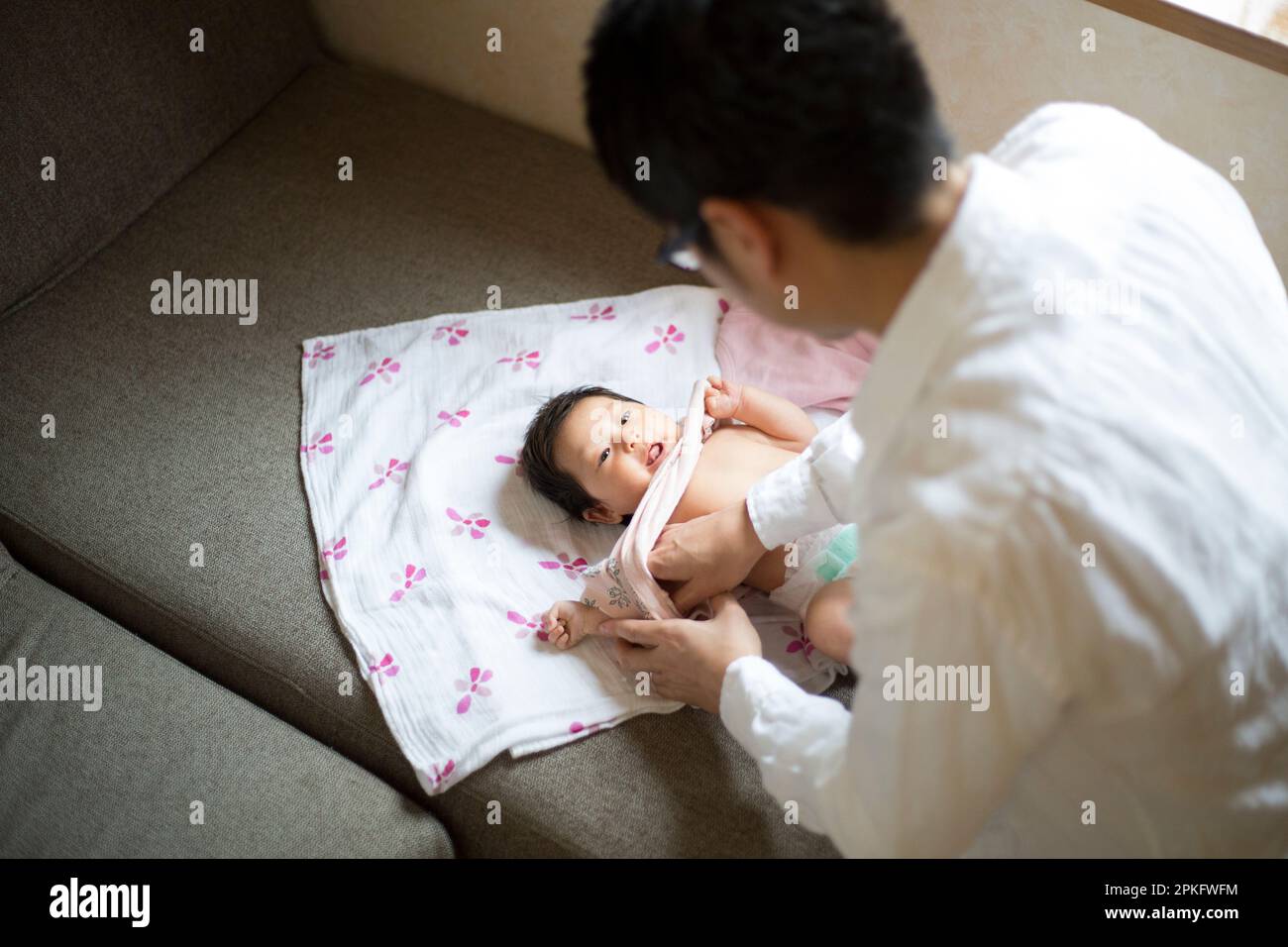 Changing baby hi-res stock photography and images - Alamy