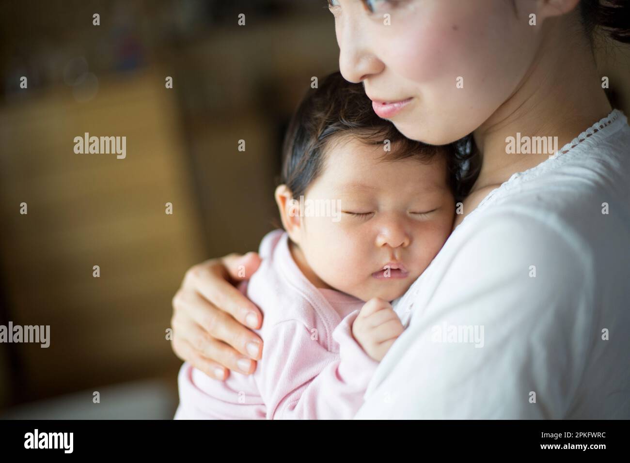 Baby sleeping mothers arms hi-res stock photography and images - Alamy