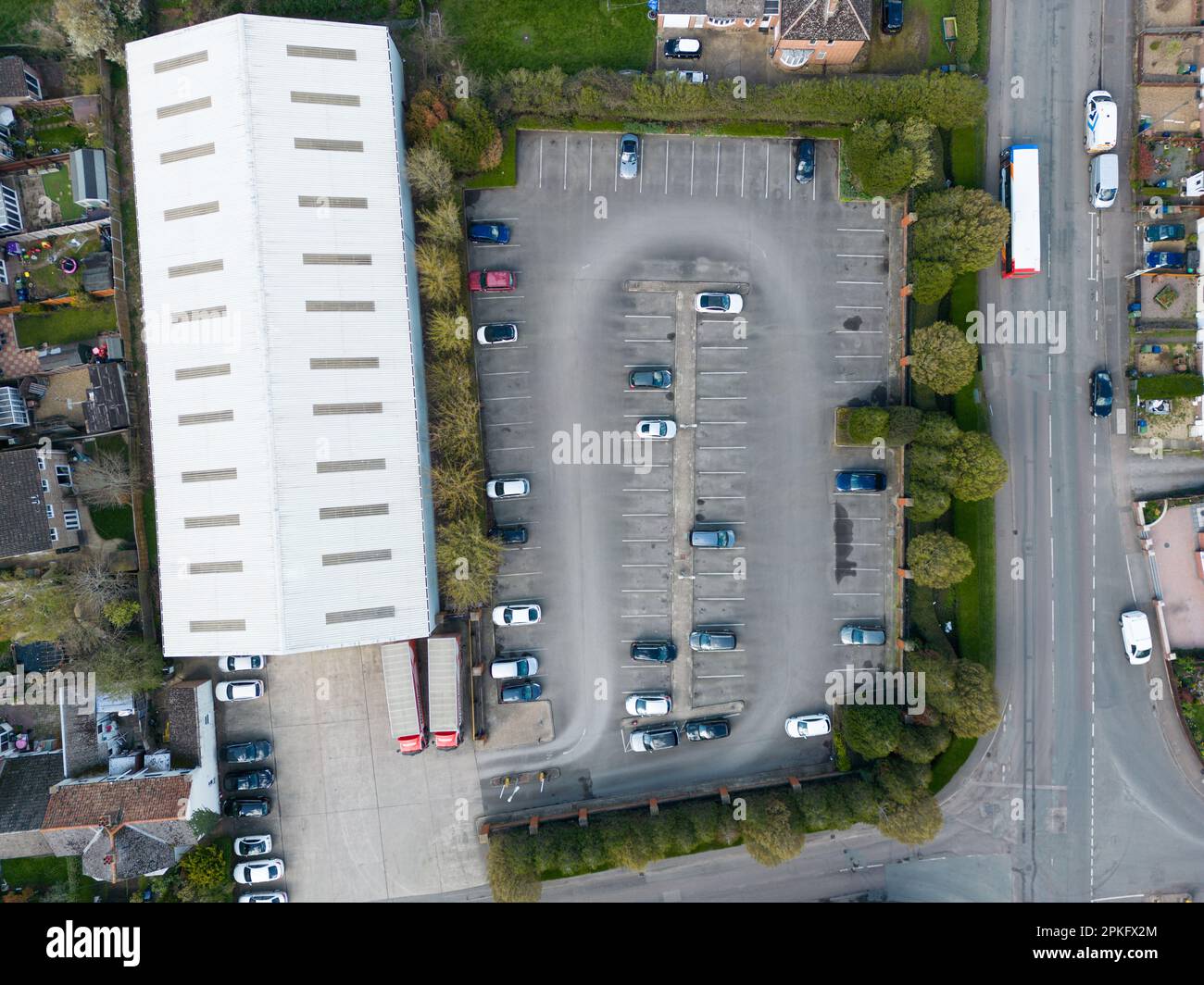 Drone top down view of a warehouse facility showing the large adjacent ...