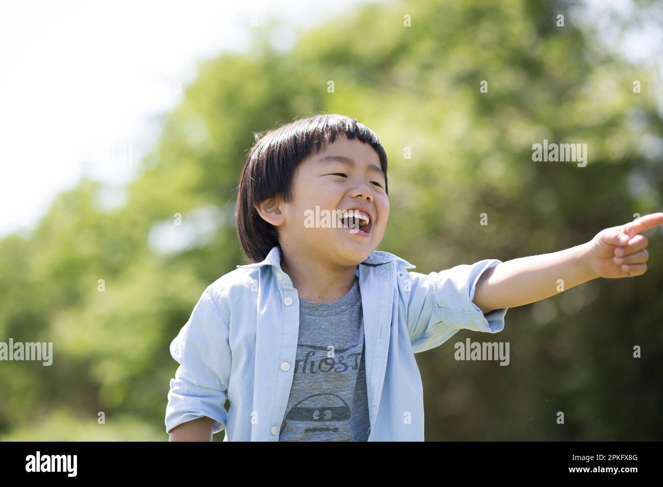 Boy pointing finger Stock Photo - Alamy