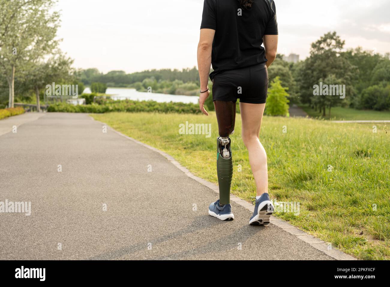 Details of a walk of a young man with prosthetic leg, young man with ...