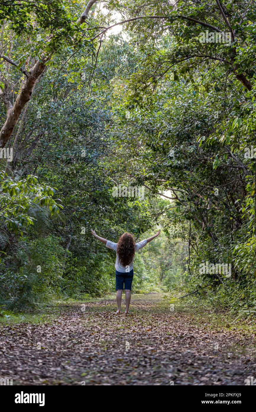 Woman young with open arms running hi-res stock photography and images ...