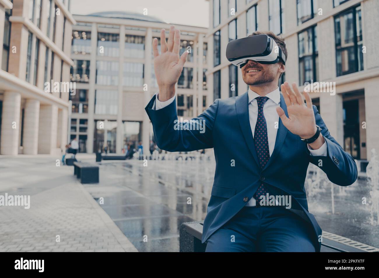 Successful young businessman dressed formally viewing future project in ...