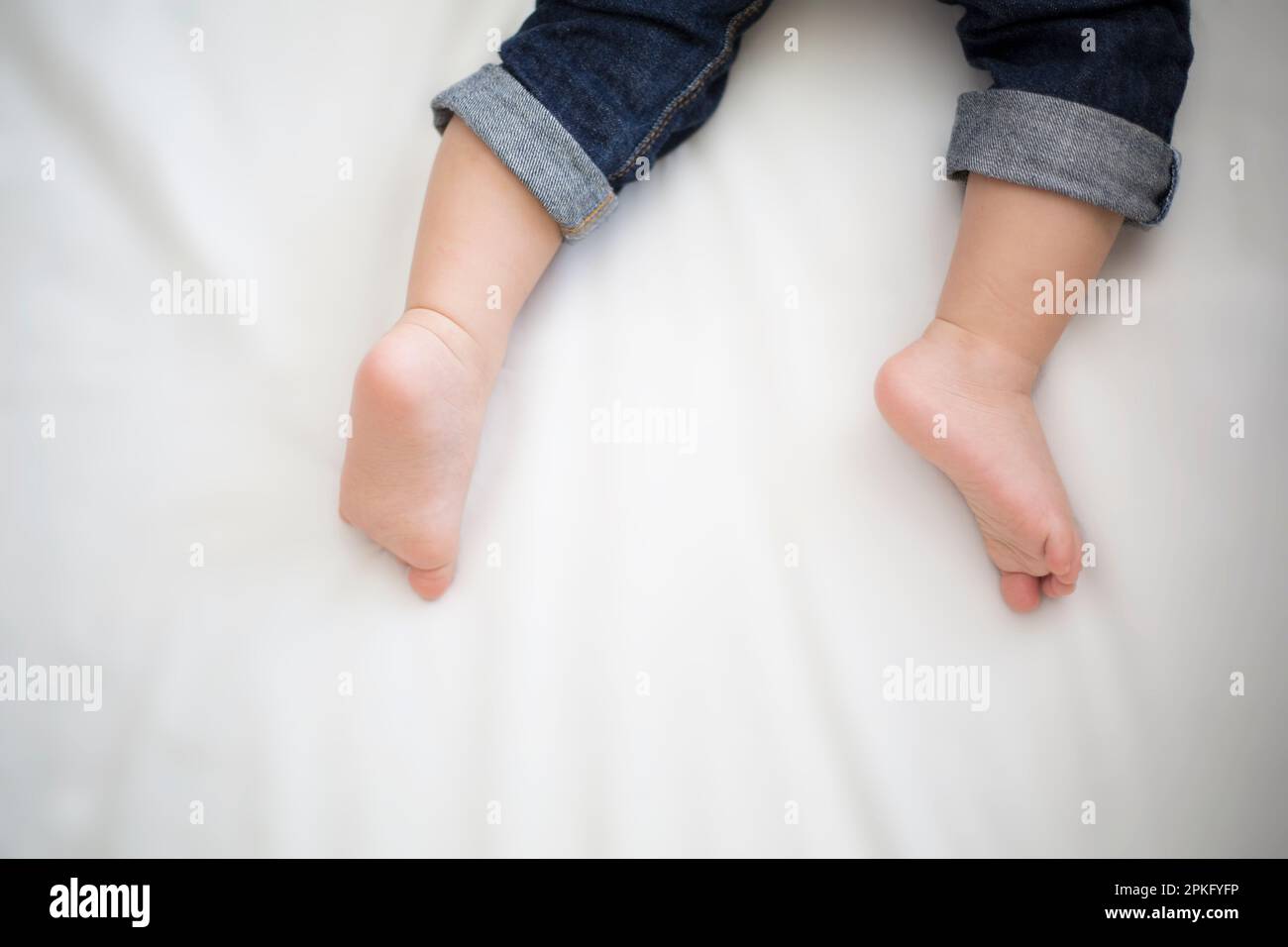 Toddler sleeping feet hi-res stock photography and images - Alamy