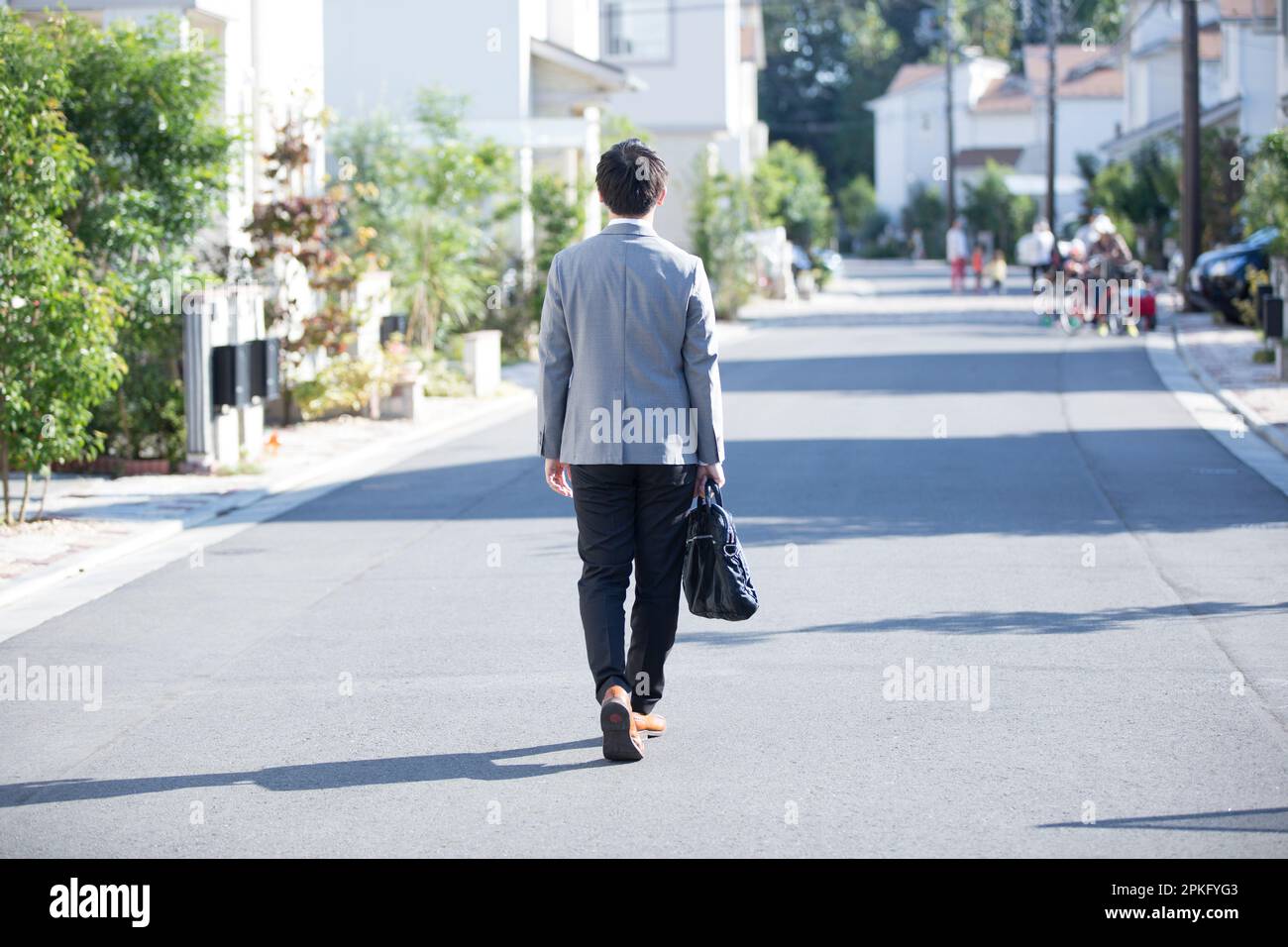 Back view of man going to work Stock Photo - Alamy
