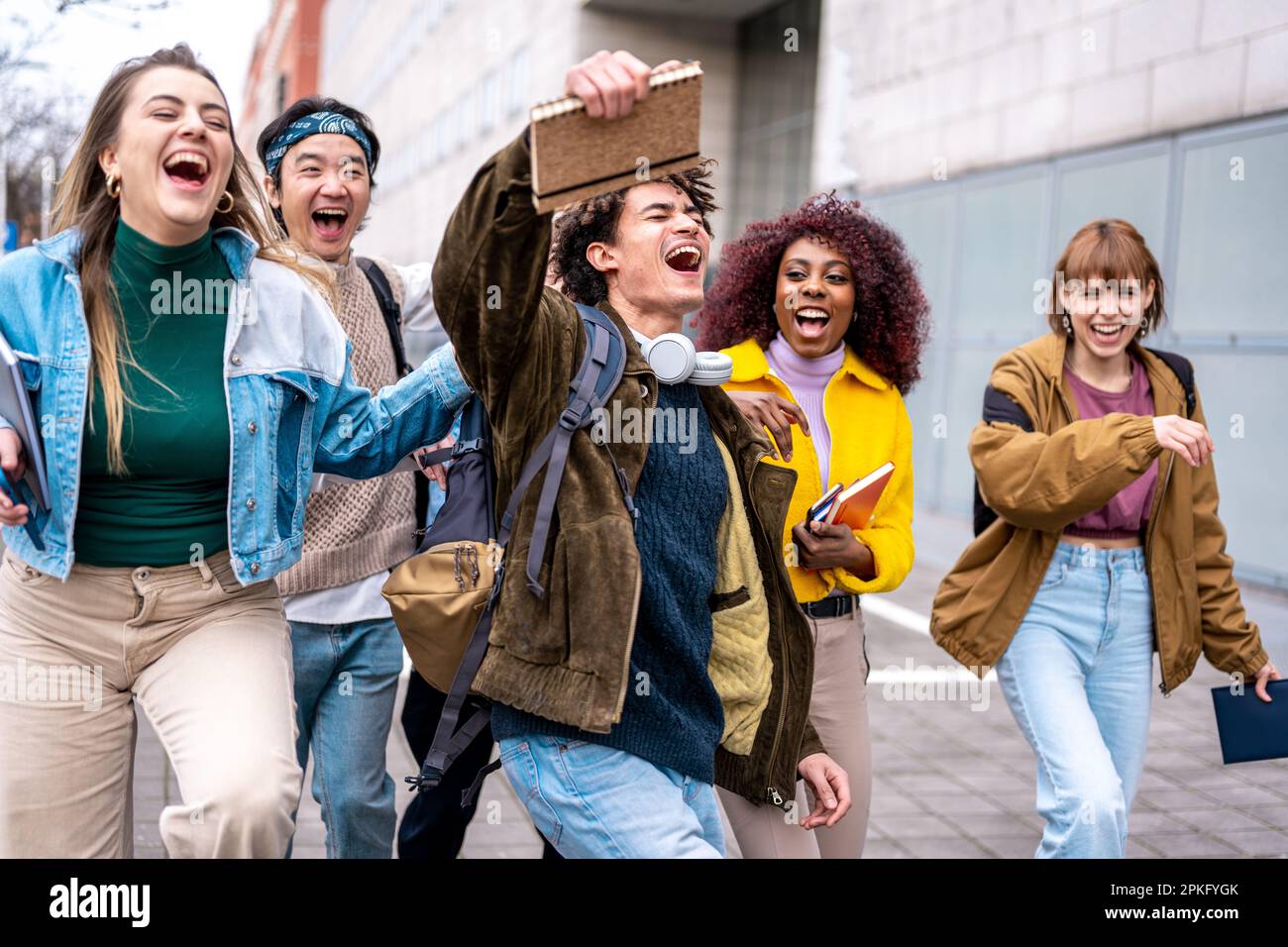 young students celebrate on the street the end of school exams ...