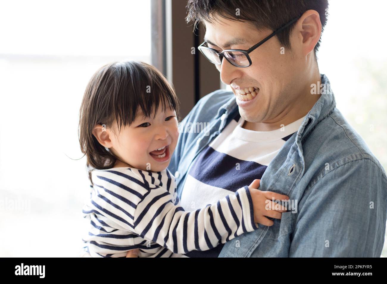 Child being carried hi-res stock photography and images - Alamy