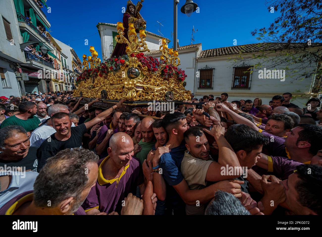 "Costaleros", who carry over their backs the portable dais platform ...