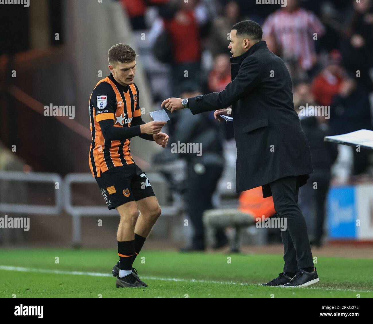 Liam Rosenior manager of Hull City hands Regan Slater #27 of Hull City ...