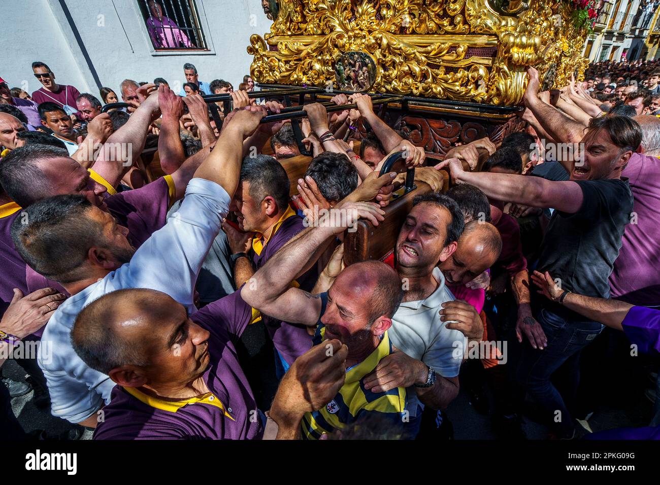 "Costaleros", who carry over their backs the portable dais platform ...