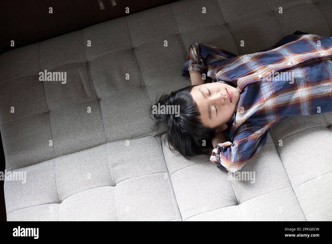 Boy sleeping on the couch Stock Photo - Alamy