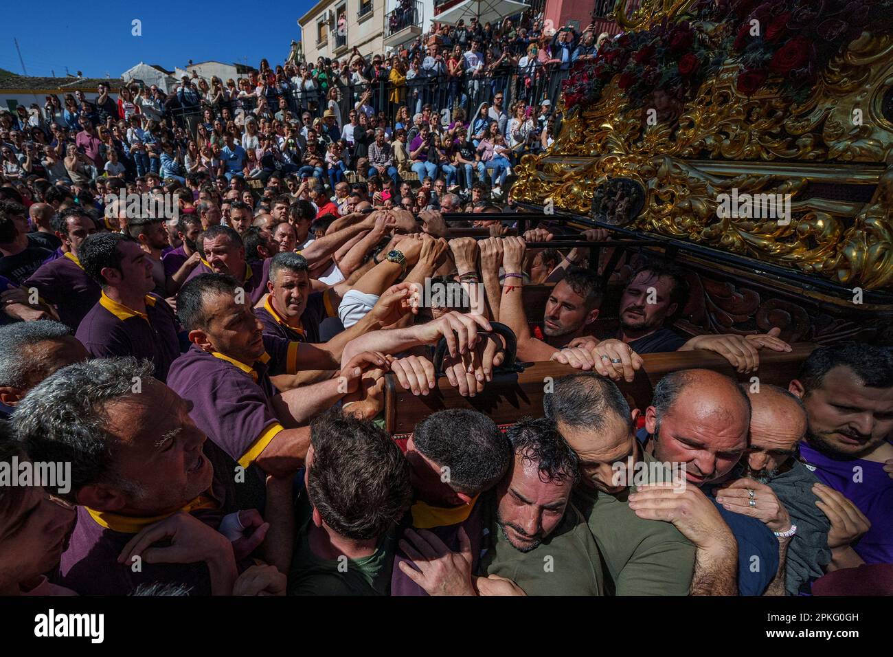 "Costaleros", who carry over their backs the portable dais platform ...