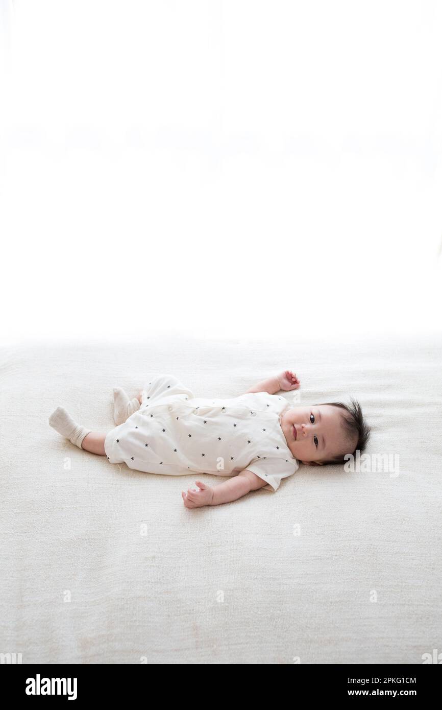 Baby sleeping on back Stock Photo - Alamy