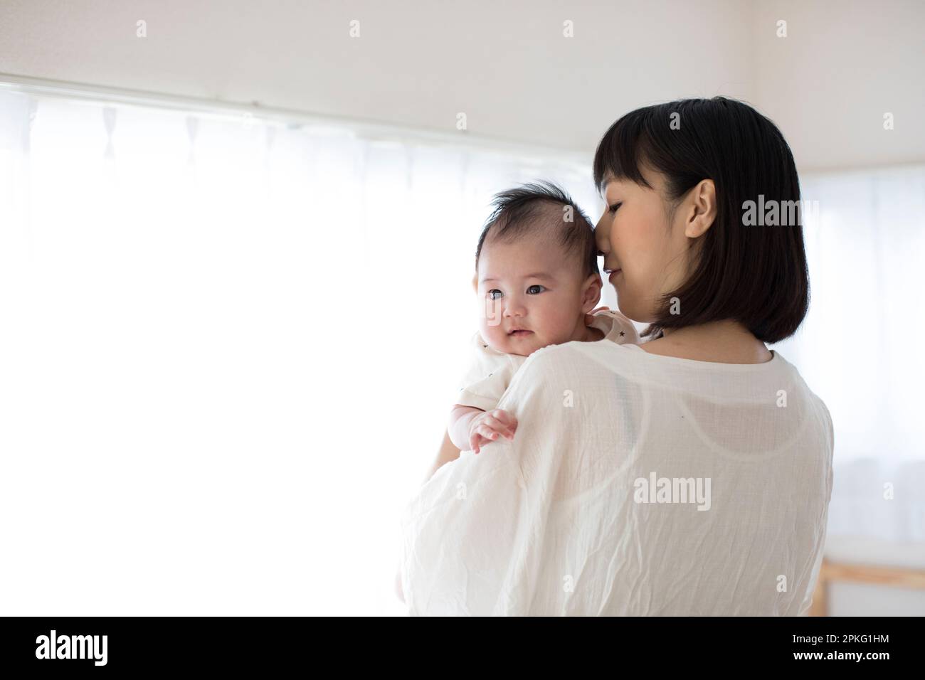 Child being held by parent hi-res stock photography and images - Alamy