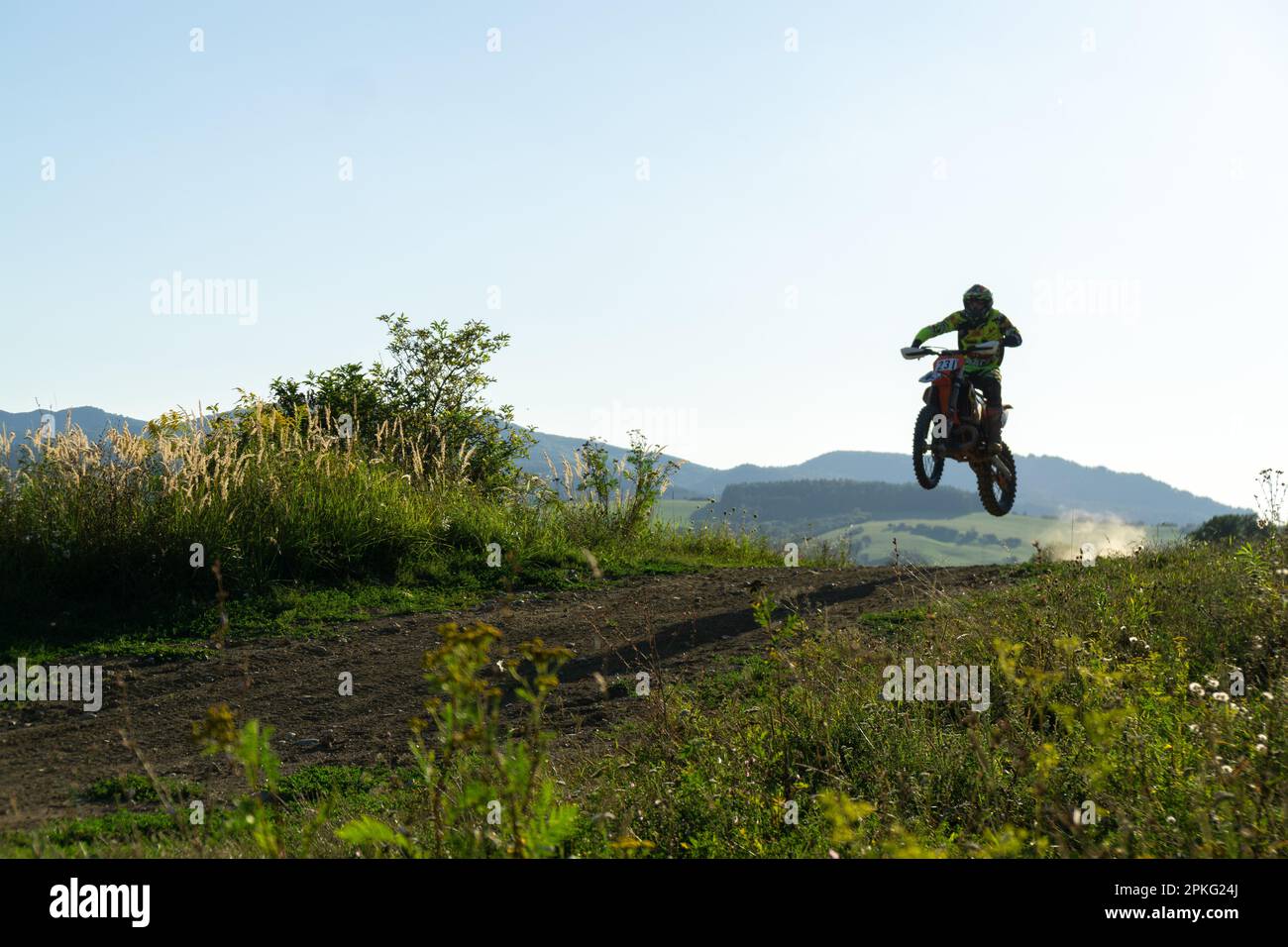 Motorbiker riding his motorbike on the motocross road in nature Stock ...