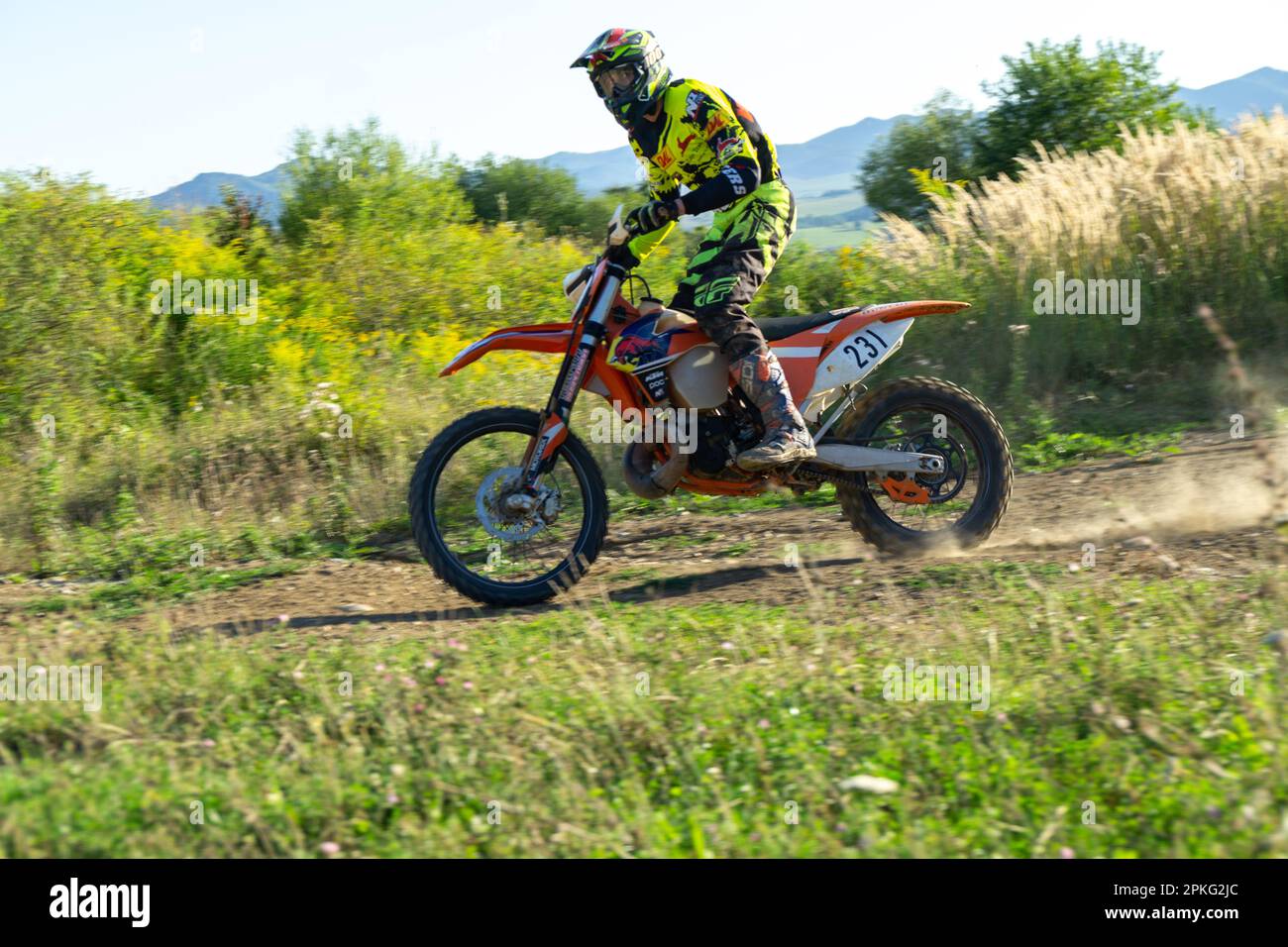 Motorbiker riding his motorbike on the motocross road in nature Stock ...