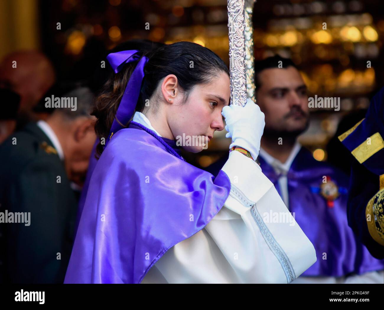 A thoughtful young woman seen during the Holy Week procession. The ...