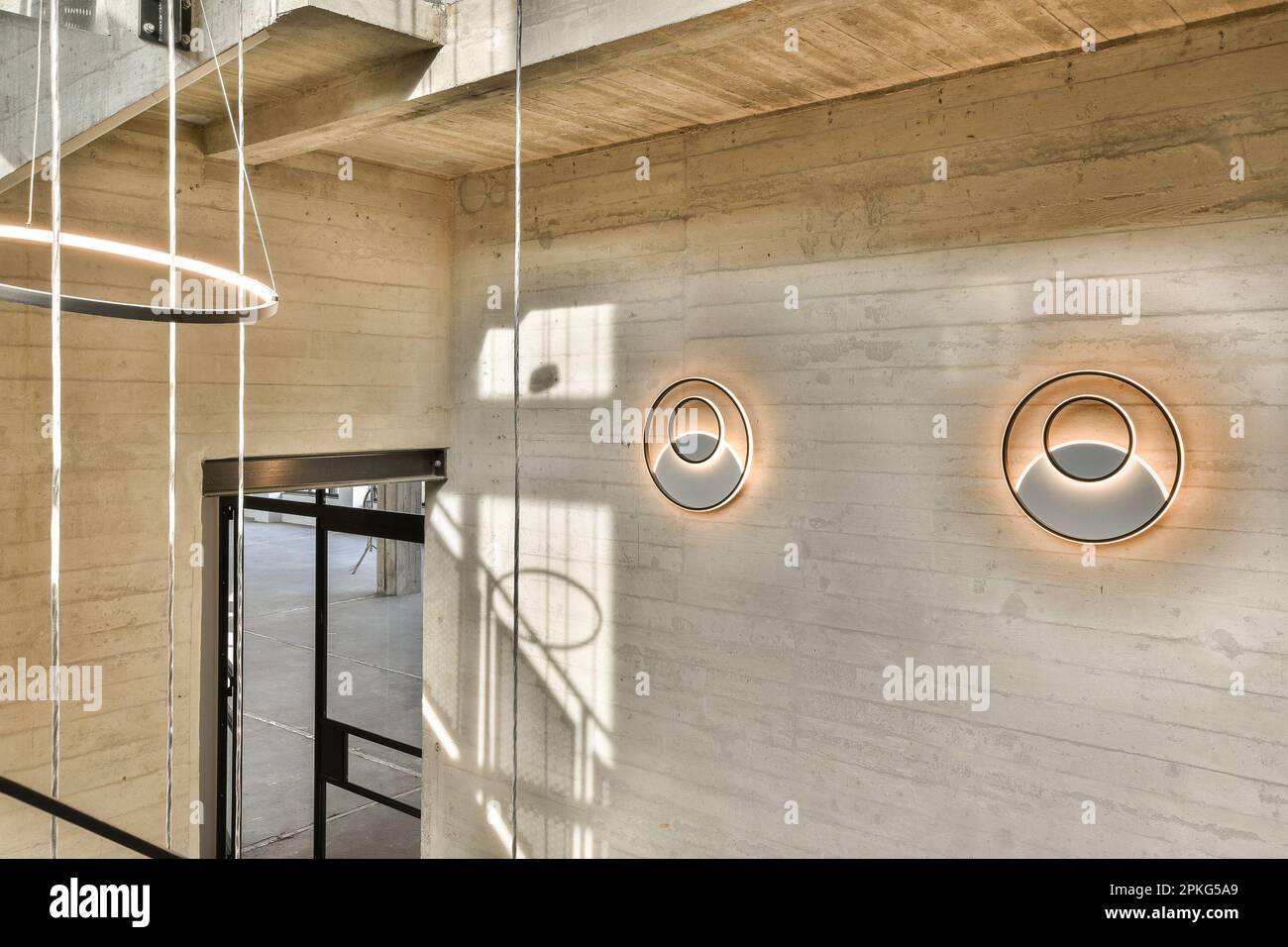 the inside of a building with three circular lights hanging from the ...