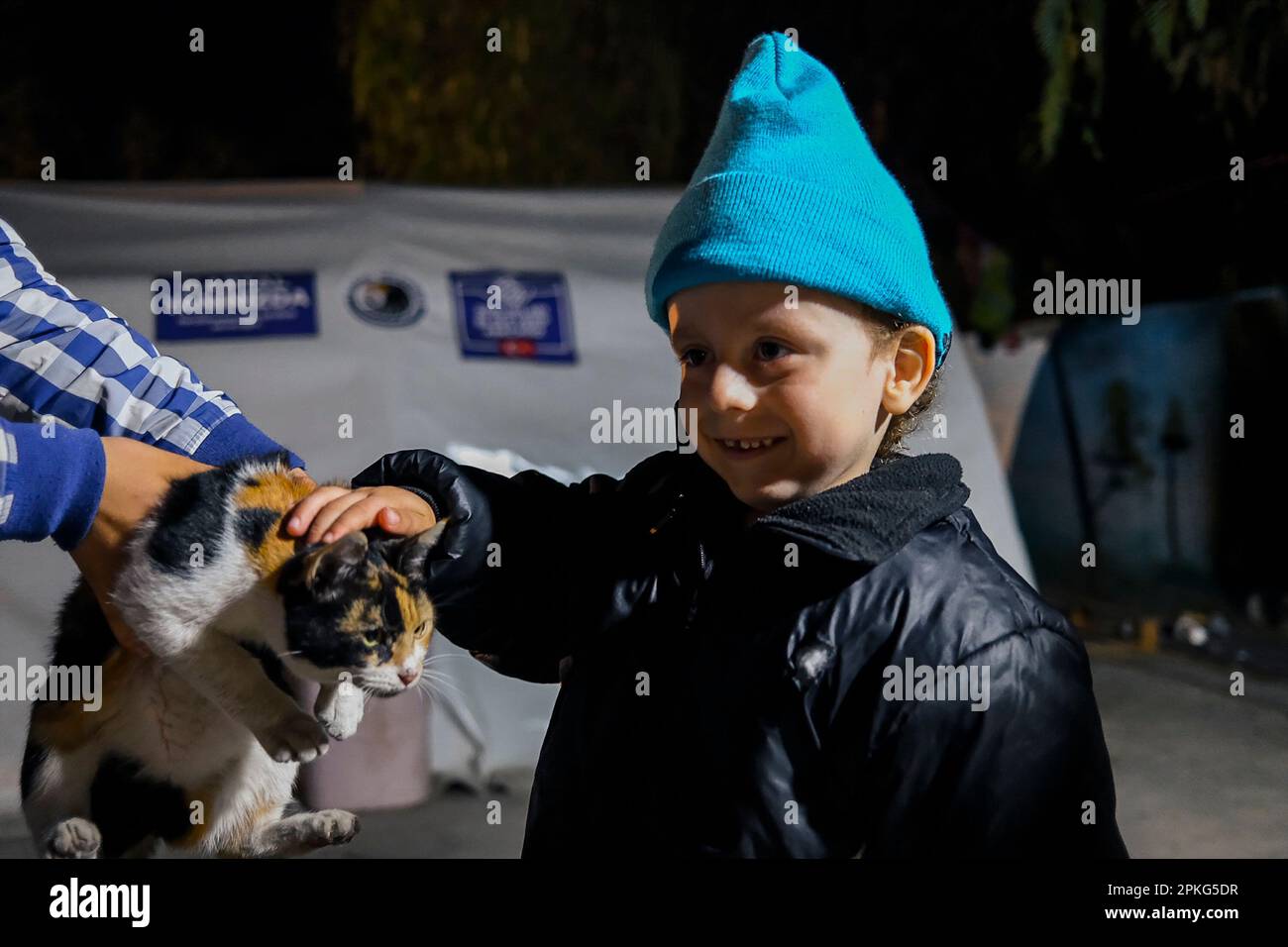 Hatay, Turkey. 06th Apr, 2023. An earthquake survivor seen petting a ...